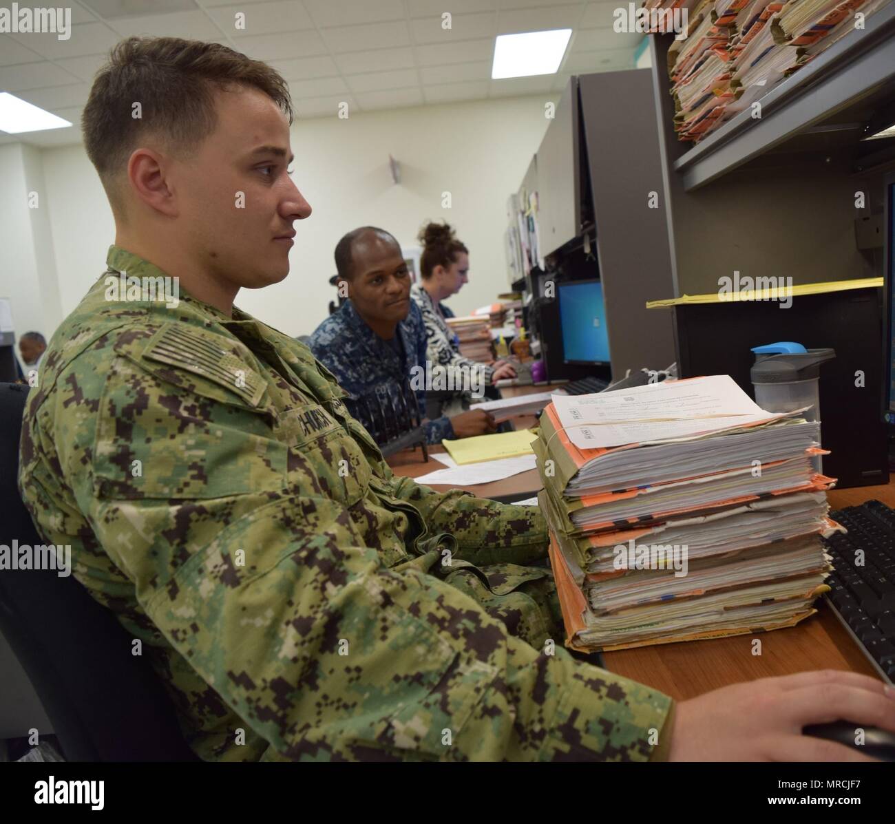 Streamlining teamwork... Hospital Corpsman 2nd Class Kyle Church (front ...