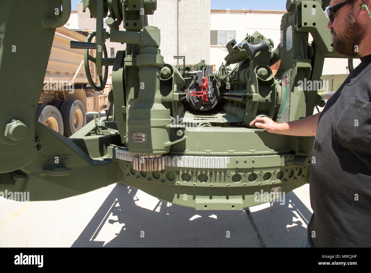 David Vierheller, artillery repair specialist, points out the breech on ...