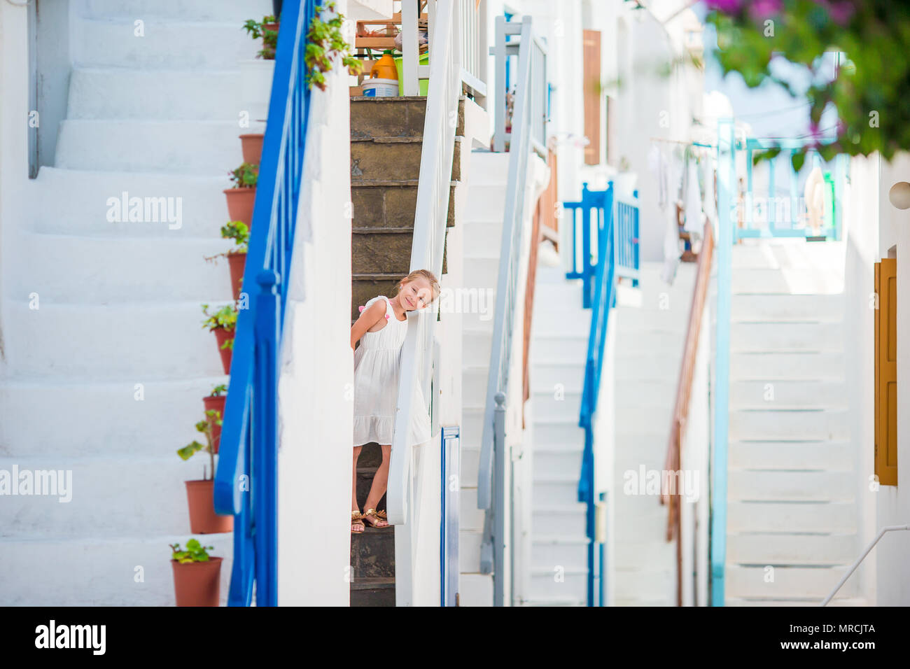 Beautiful girl at street of greek traditional village on Mykonos Stock ...