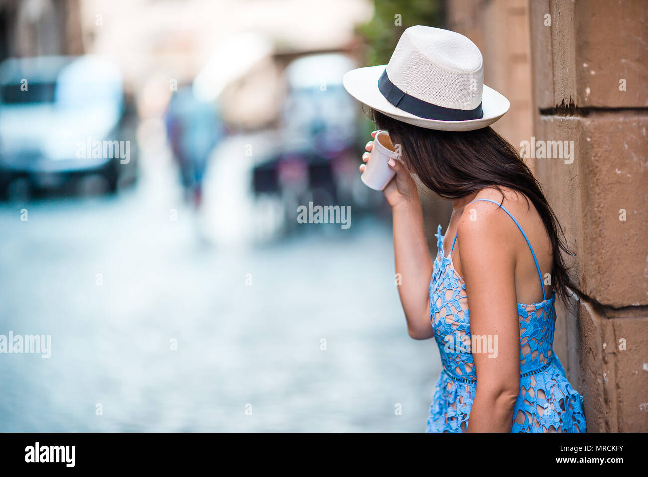 Woman in Rome with coffee to go on vacation travel. Smiling happy ...