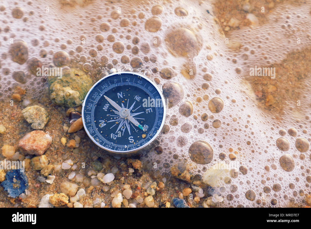 Compass on the beach Stock Photo - Alamy