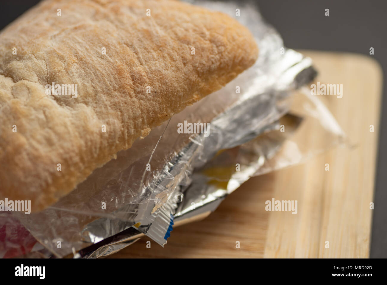 Fresh tasty panini sandwich with plastic waste and paper cardboard ...