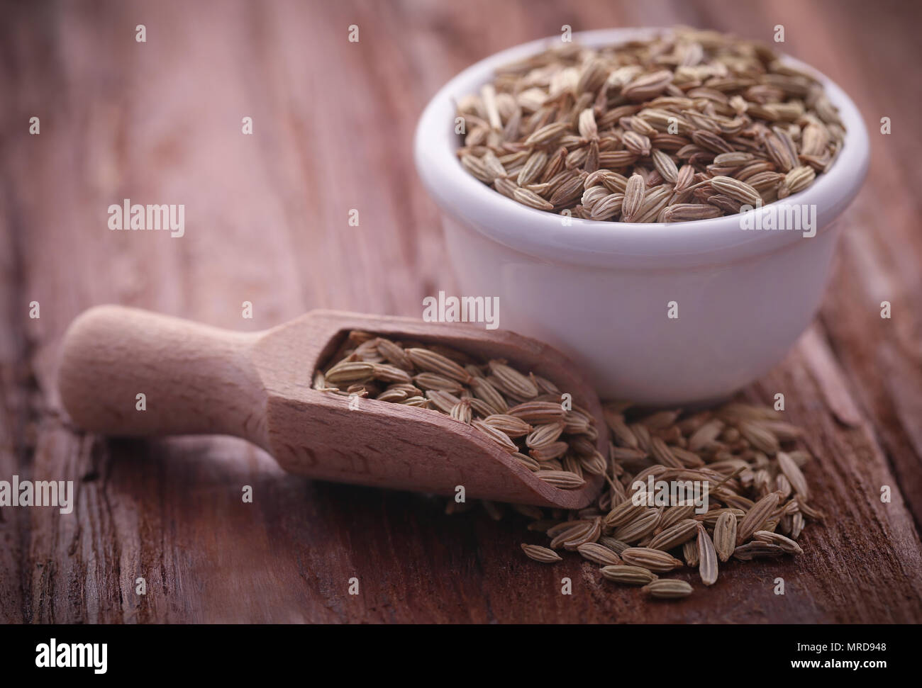 Fennel seeds in a scoop on natural surface Stock Photo - Alamy