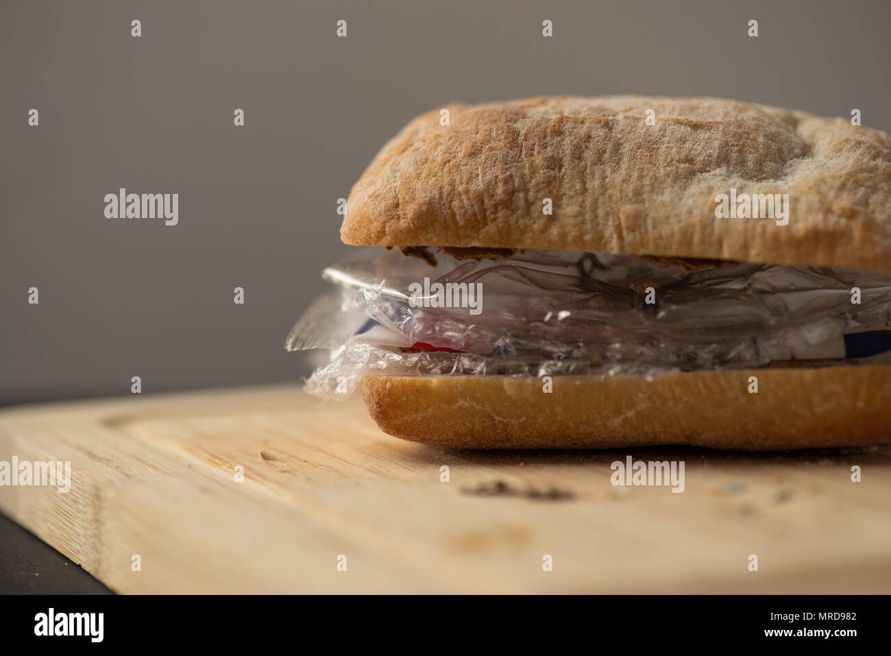 Fresh tasty panini sandwich with plastic waste and paper cardboard ...
