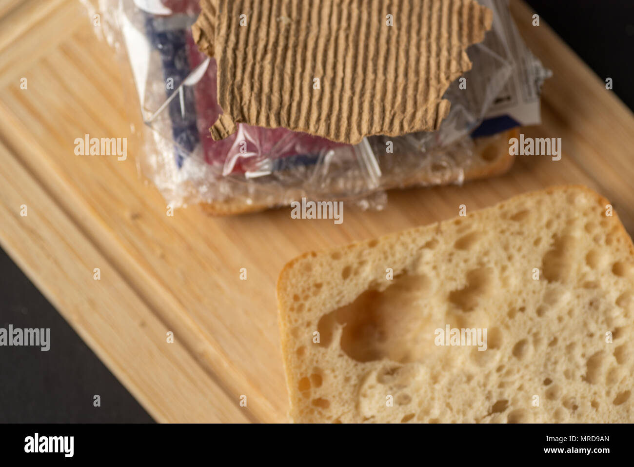Fresh tasty panini sandwich with plastic waste and paper cardboard ...