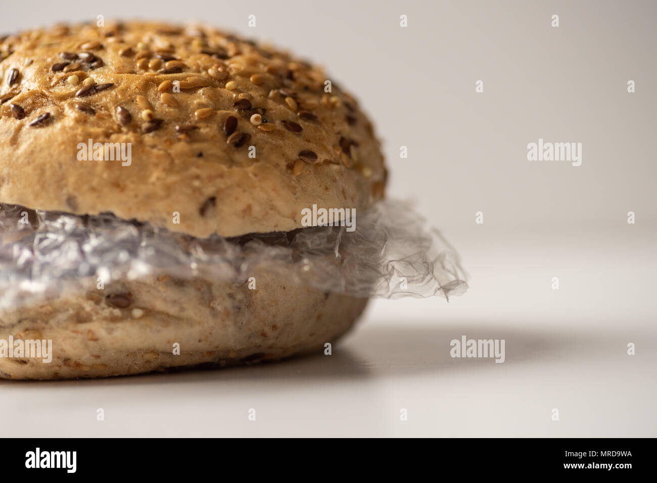 Fresh tasty burger with plastic waste and paper cardboard inside on ...