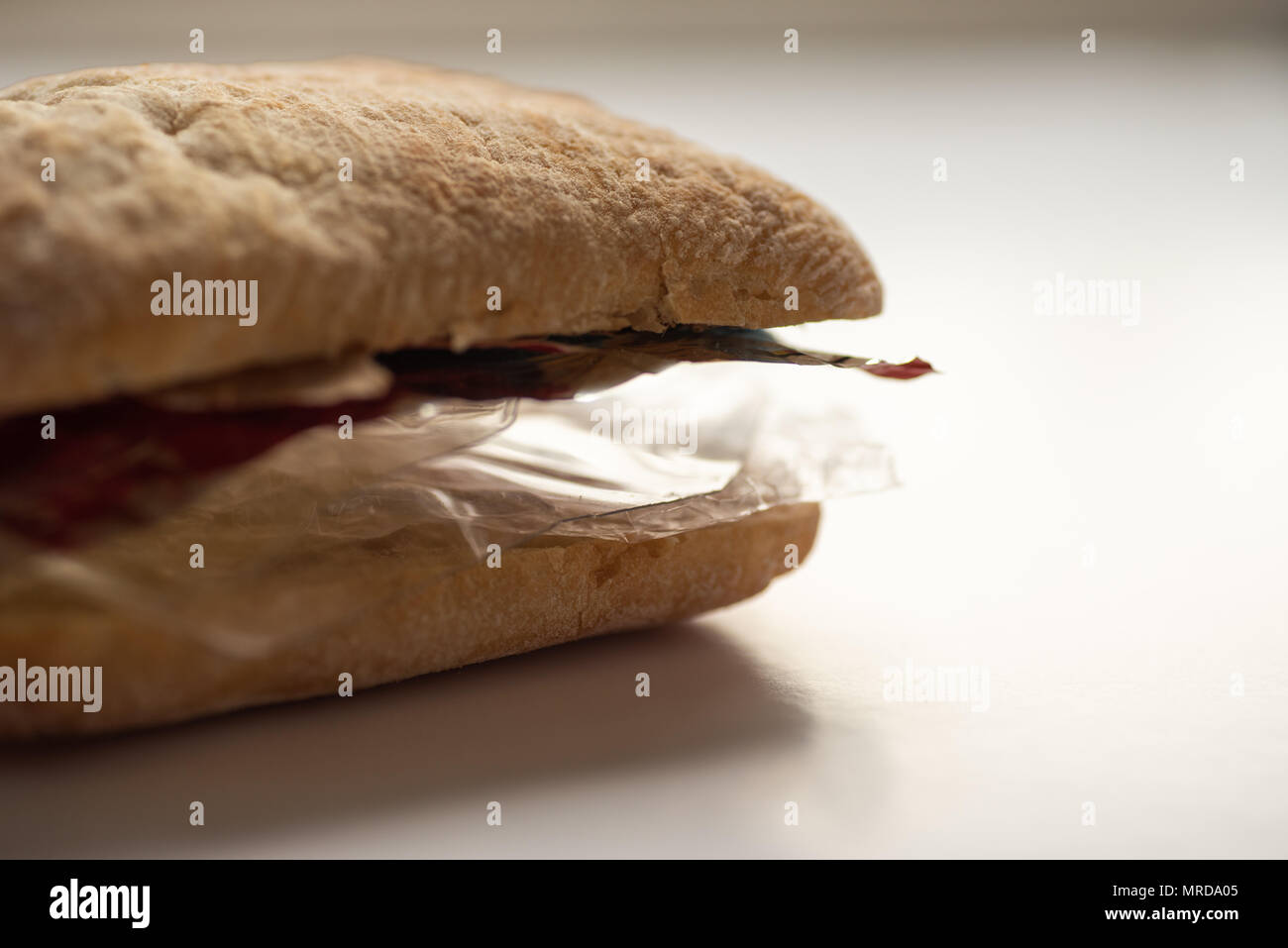 Fresh tasty panini sandwich with plastic waste and paper cardboard ...