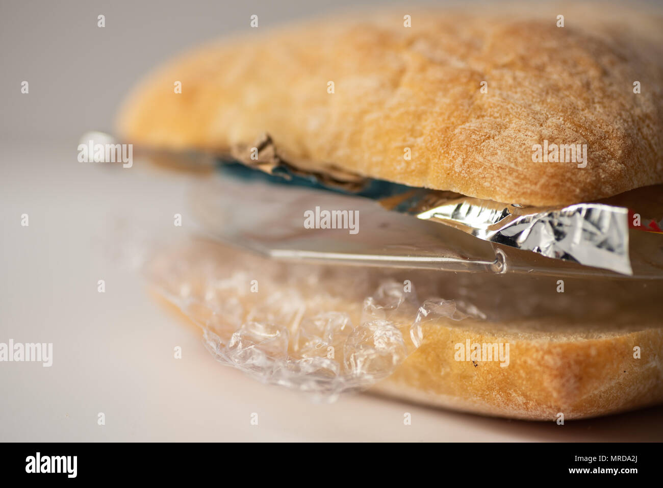 Fresh tasty panini sandwich with plastic waste and paper cardboard ...