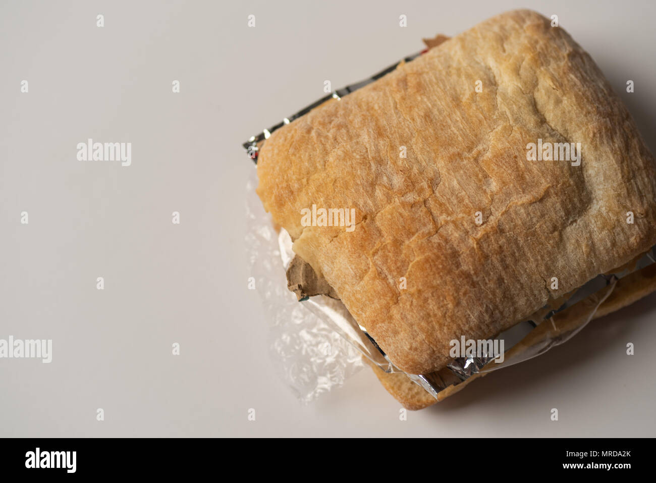 Fresh tasty panini sandwich with plastic waste and paper cardboard ...