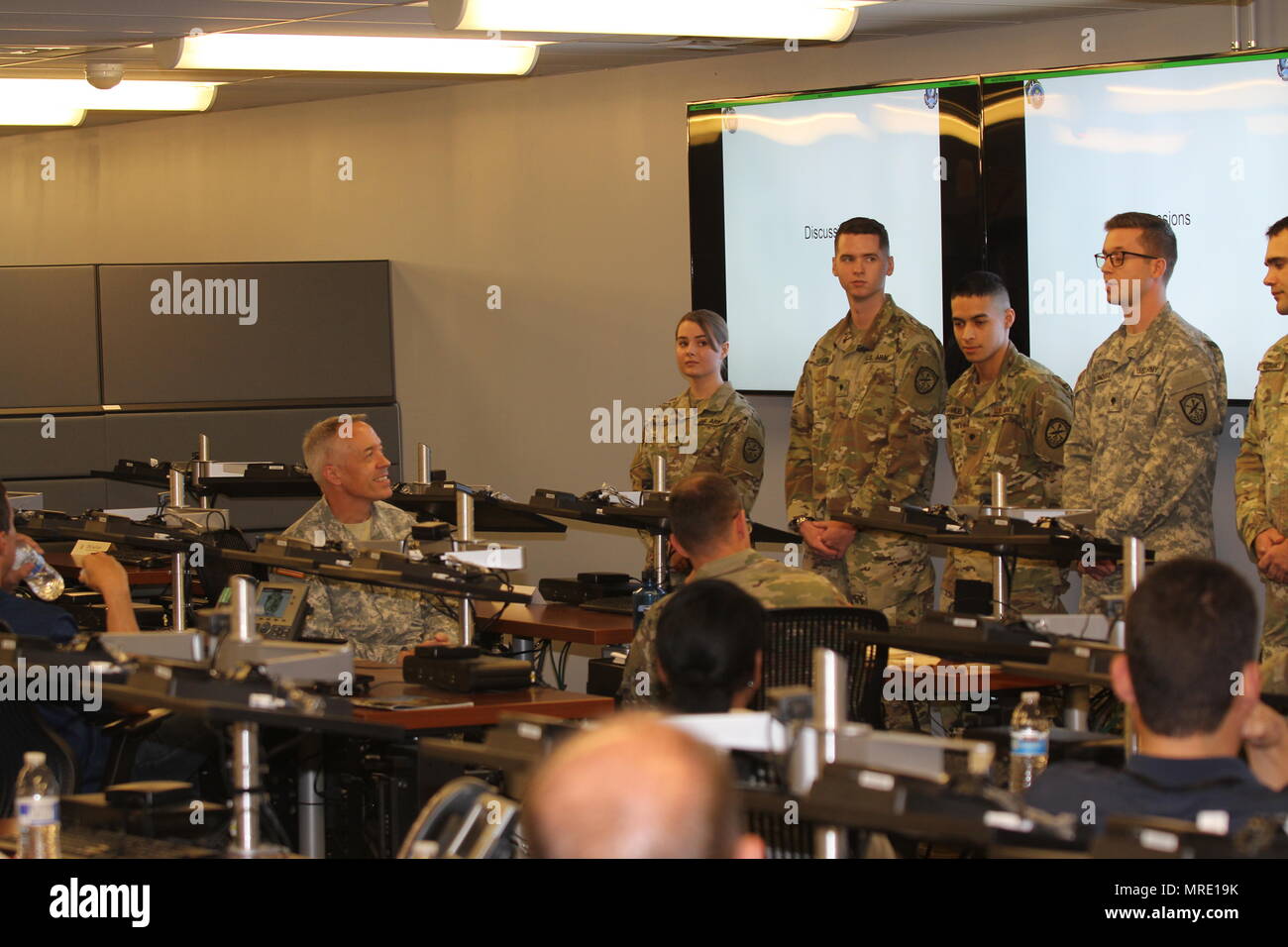 Soldiers assigned to the 780th Military Intelligence (MI) Brigade talk ...