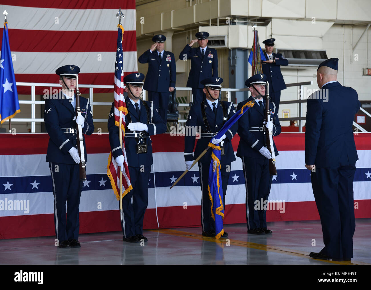 The official party salutes during the singing of the National Anthem at ...