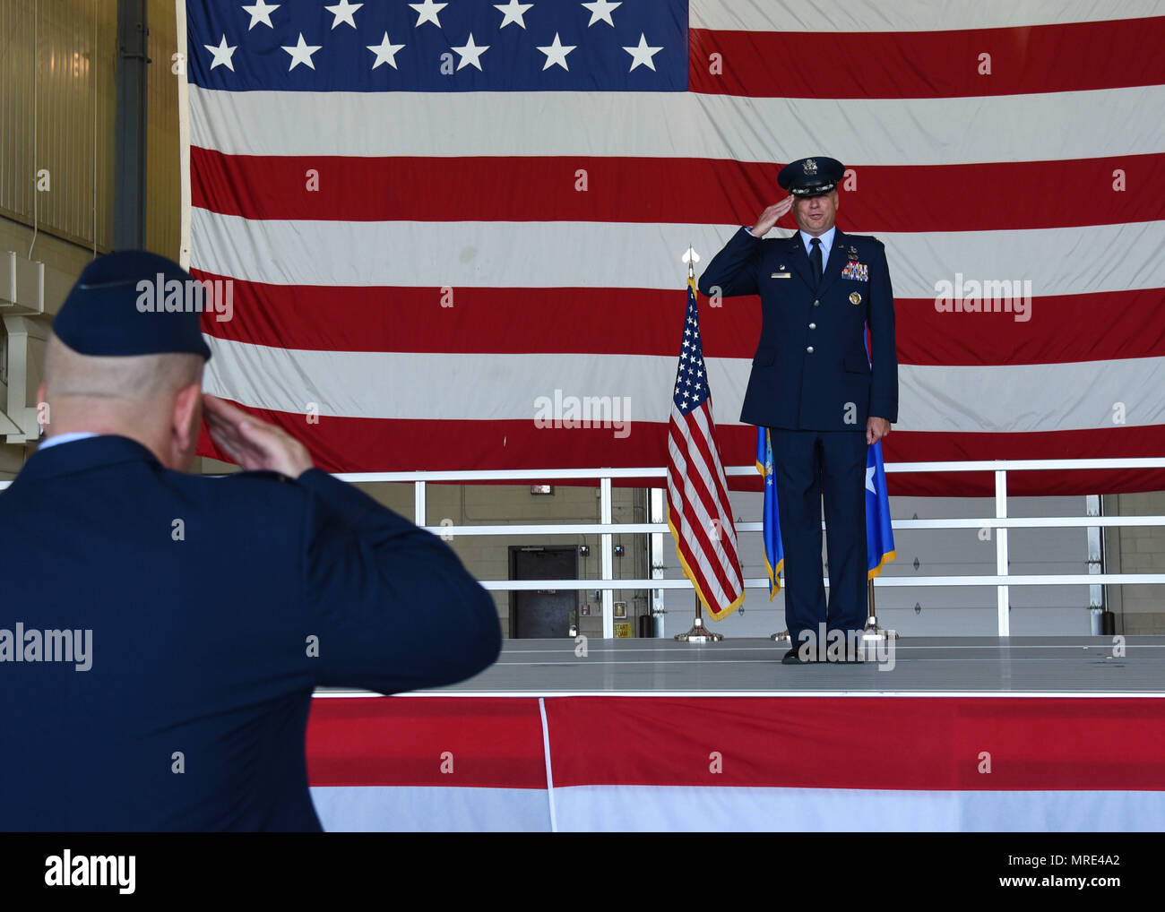 Col. Benjamin Spencer, right, gives his first salute as the new ...