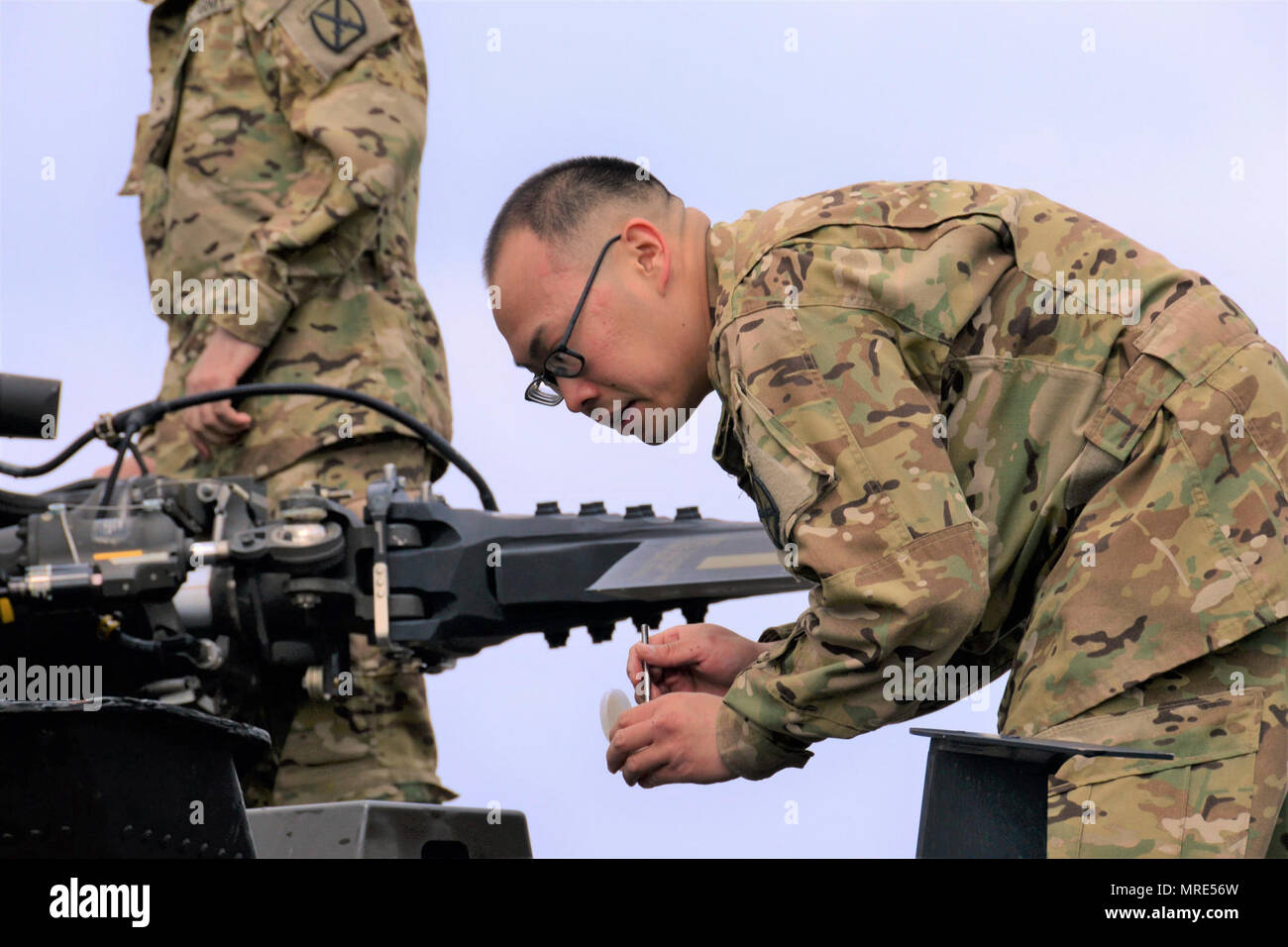 U.S. Army Spc. Brian Lee, a UH-60 Black Hawk crew chief (15T military ...