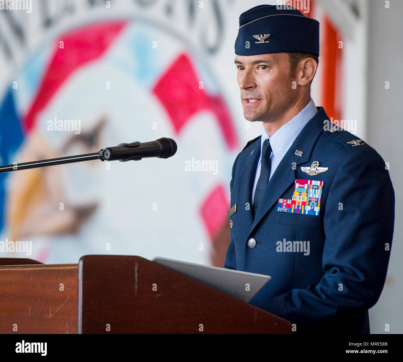 Col. Paul Moga speaks to the crowd and his Airmen after taking command ...