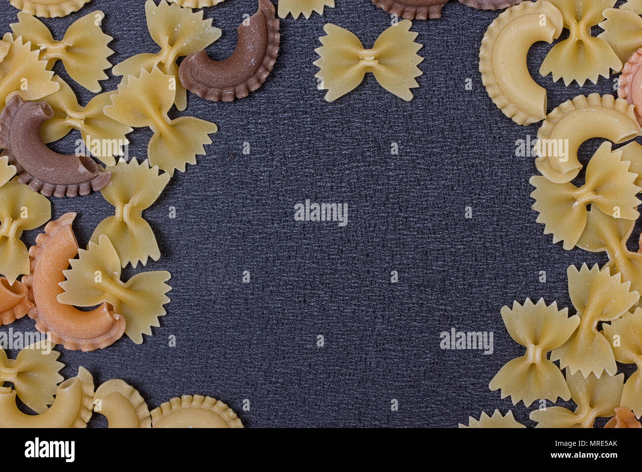 Variety of types of Italian pasta background. Set of raw dry pasta on a ...