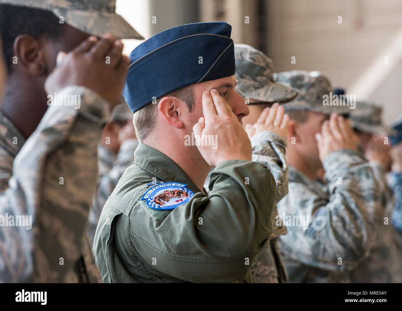 A 58th Fighter Squadron captain salutes while in formation during the ...