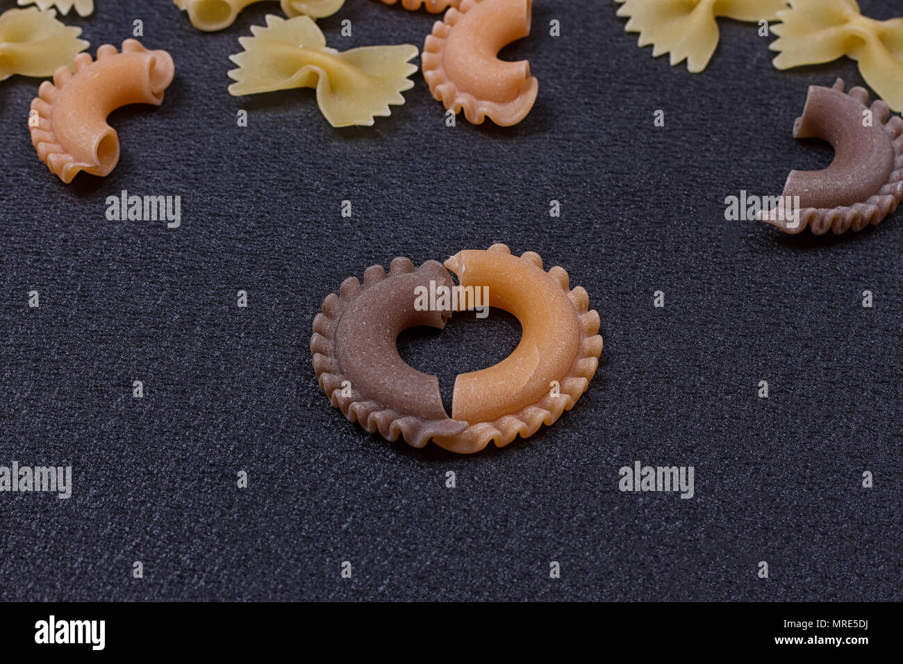Variety of types of Italian pasta background. Set of raw dry pasta on a ...