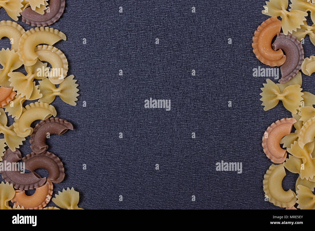 Variety of types of Italian pasta background. Set of raw dry pasta on a ...