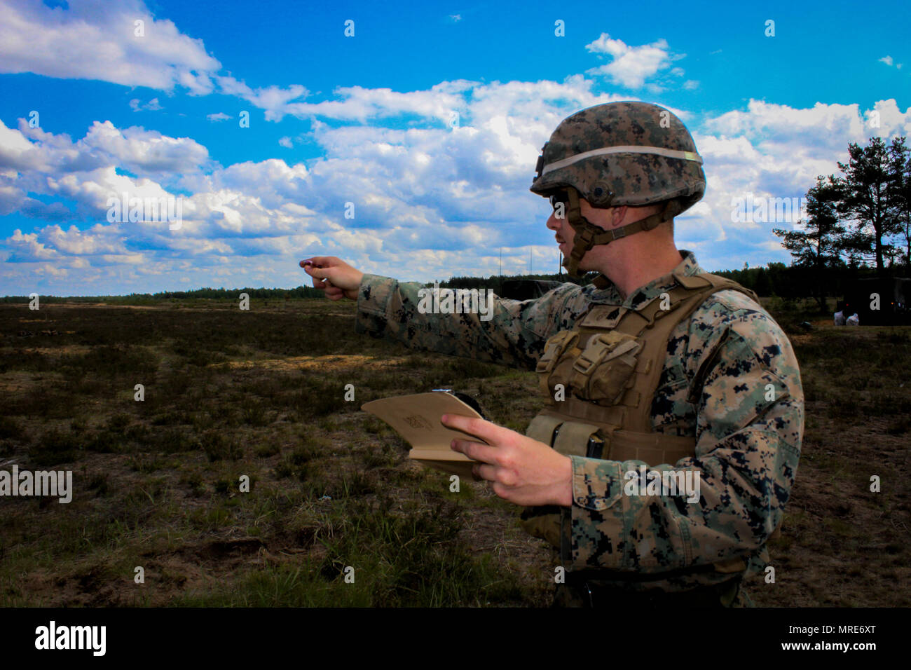 A U.S. Marine with Black Sea Rotational Force 17.1 gives commands from ...