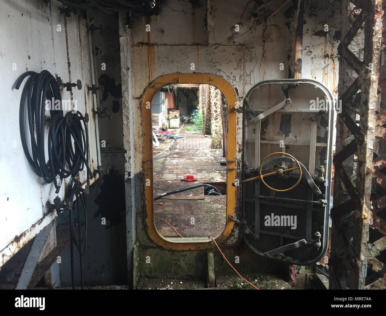 A passageway aboard a derelict vessel located at a submerged-land site ...