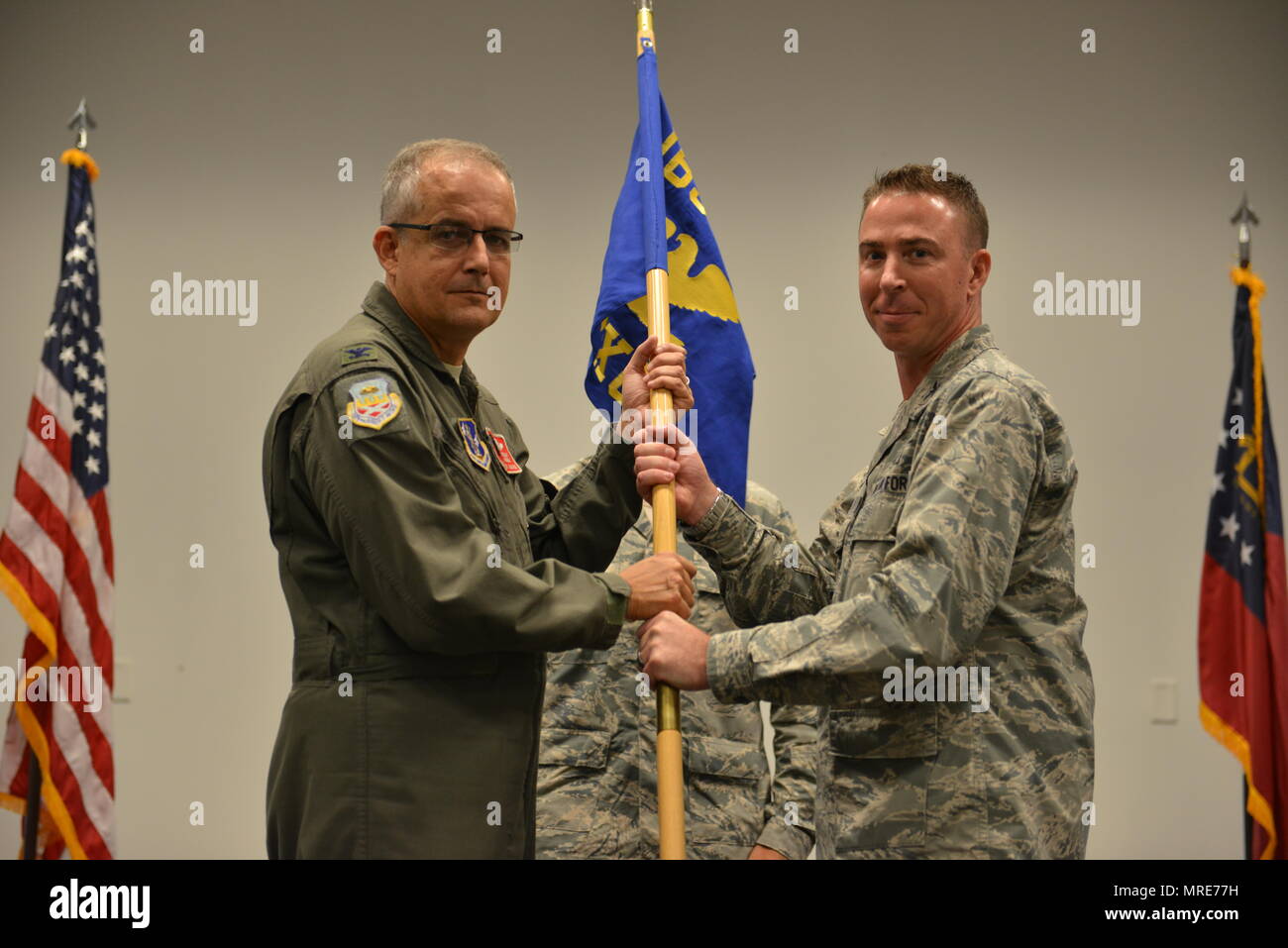 U.S. Air Force 165th Airlift Wing Commander Col. Rainer Gomez accepts ...