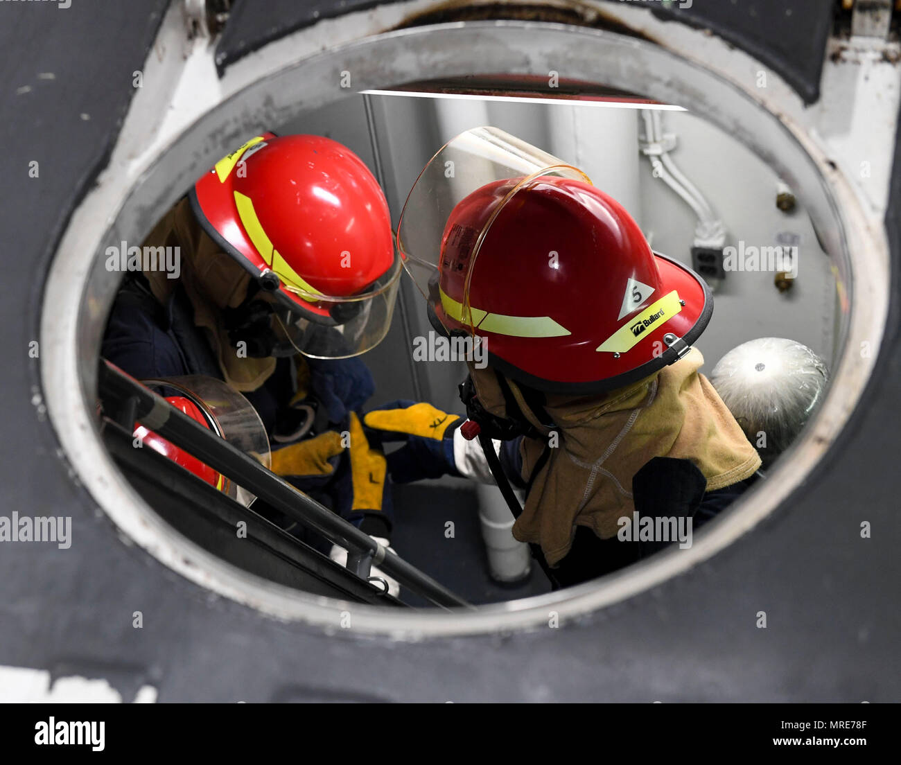 170608-N-RM689-399 WESTERN PACIFIC (June 8, 2017) Members of a fire ...