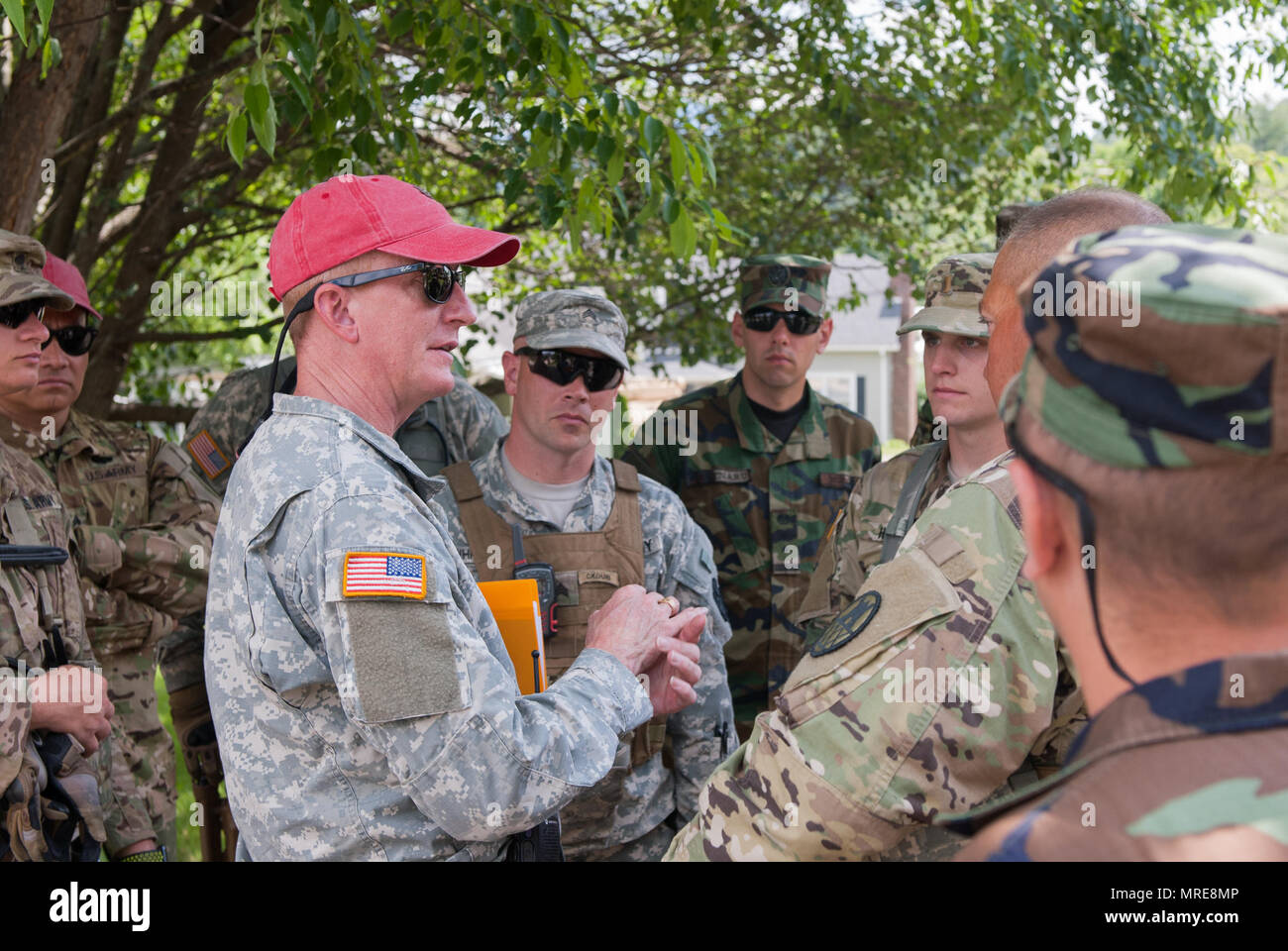 An observer controller conducts an after action review with North ...