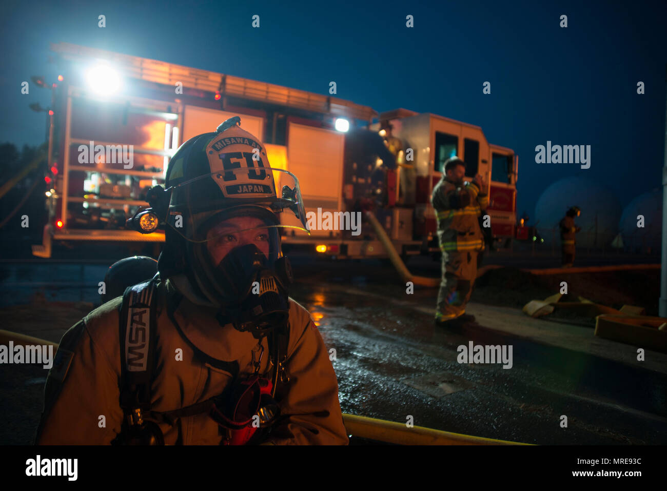 Kenichi Umemura, a 35th Civil Engineer Squadron firefighter, monitors a ...