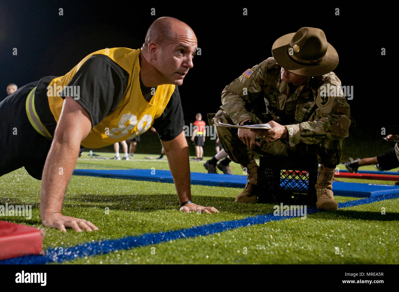 A Warrior conducts push-ups during the Army Physical Fitnes Test during ...