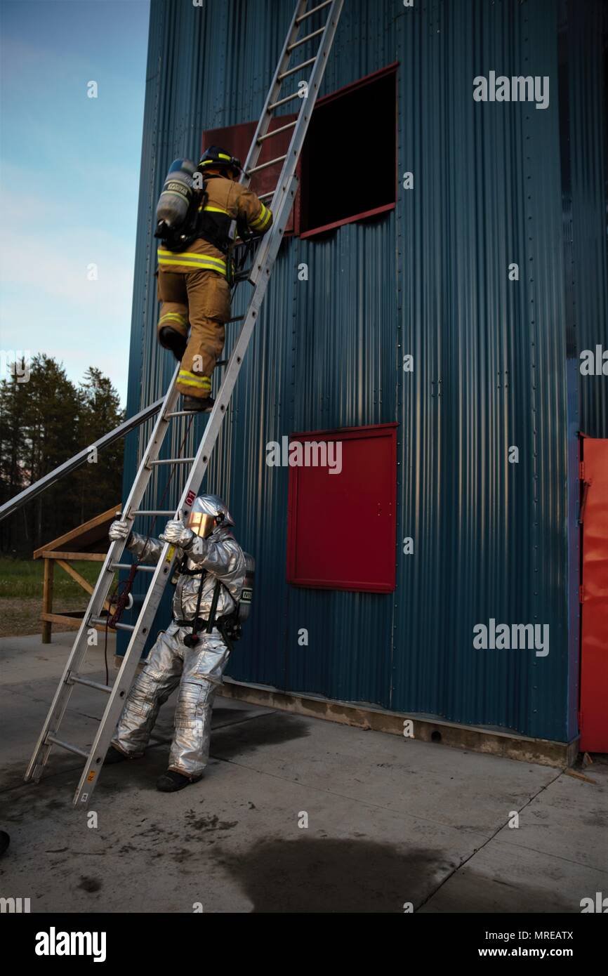 A Royal Canadian Air Force Firefighter with 4 Wing Fire Service, Armed ...
