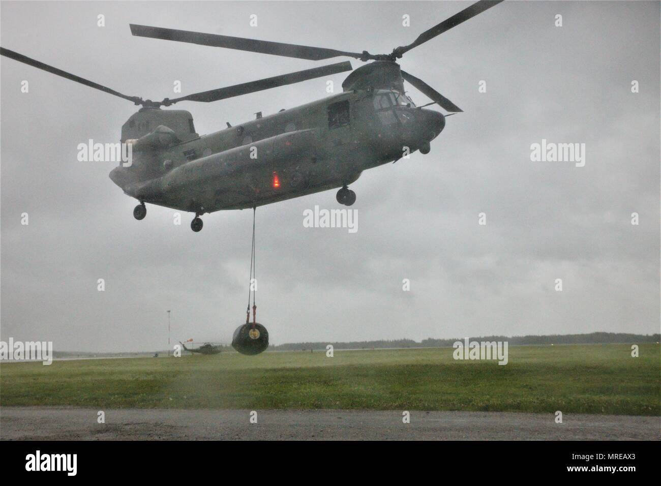 A Royal Canadian Air Force CH-147F Chinook air lifts a sling loaded ...