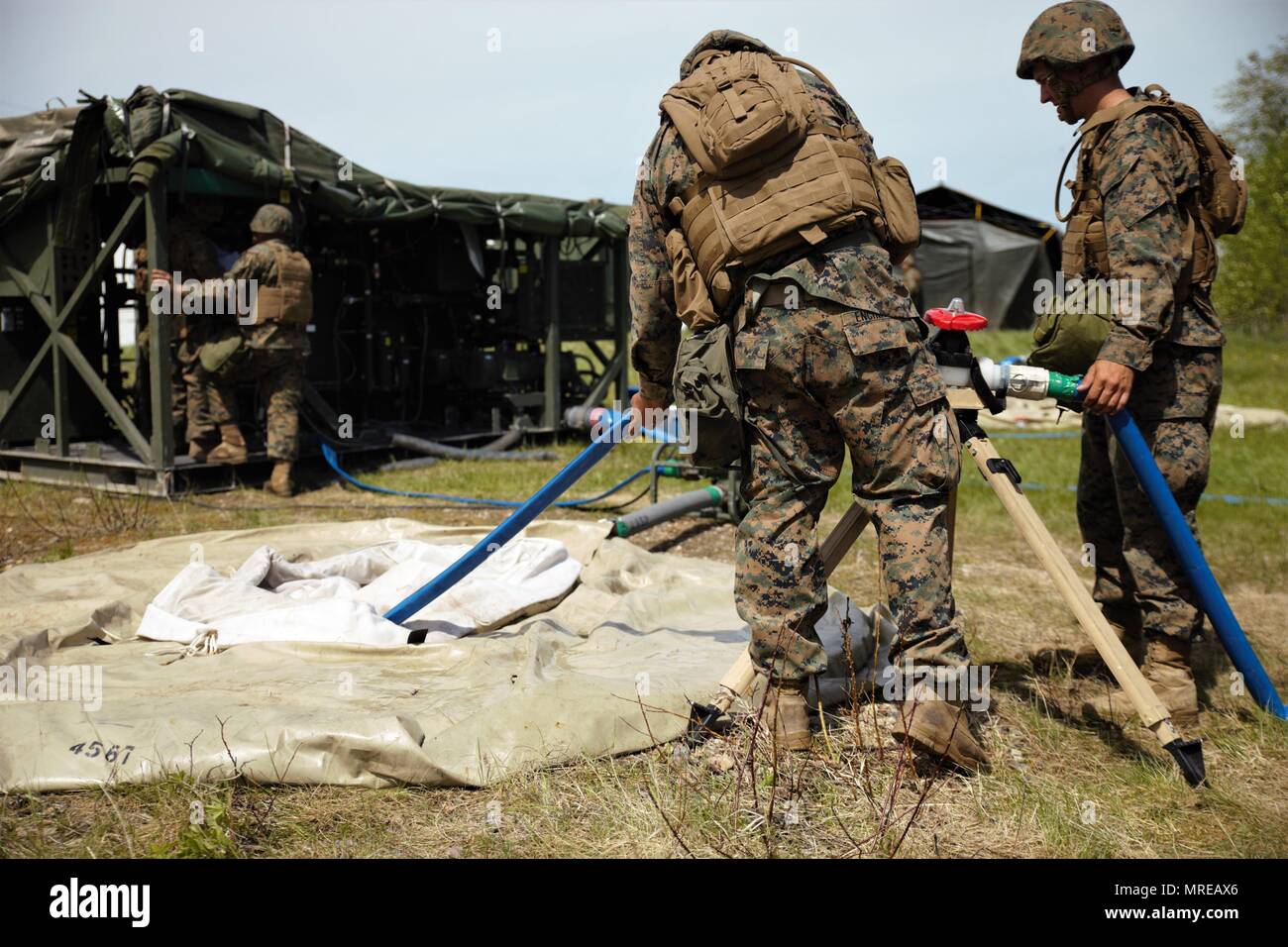 Marines with Utilities Platoon, Marine Wing Support Squadron 473, 4th ...