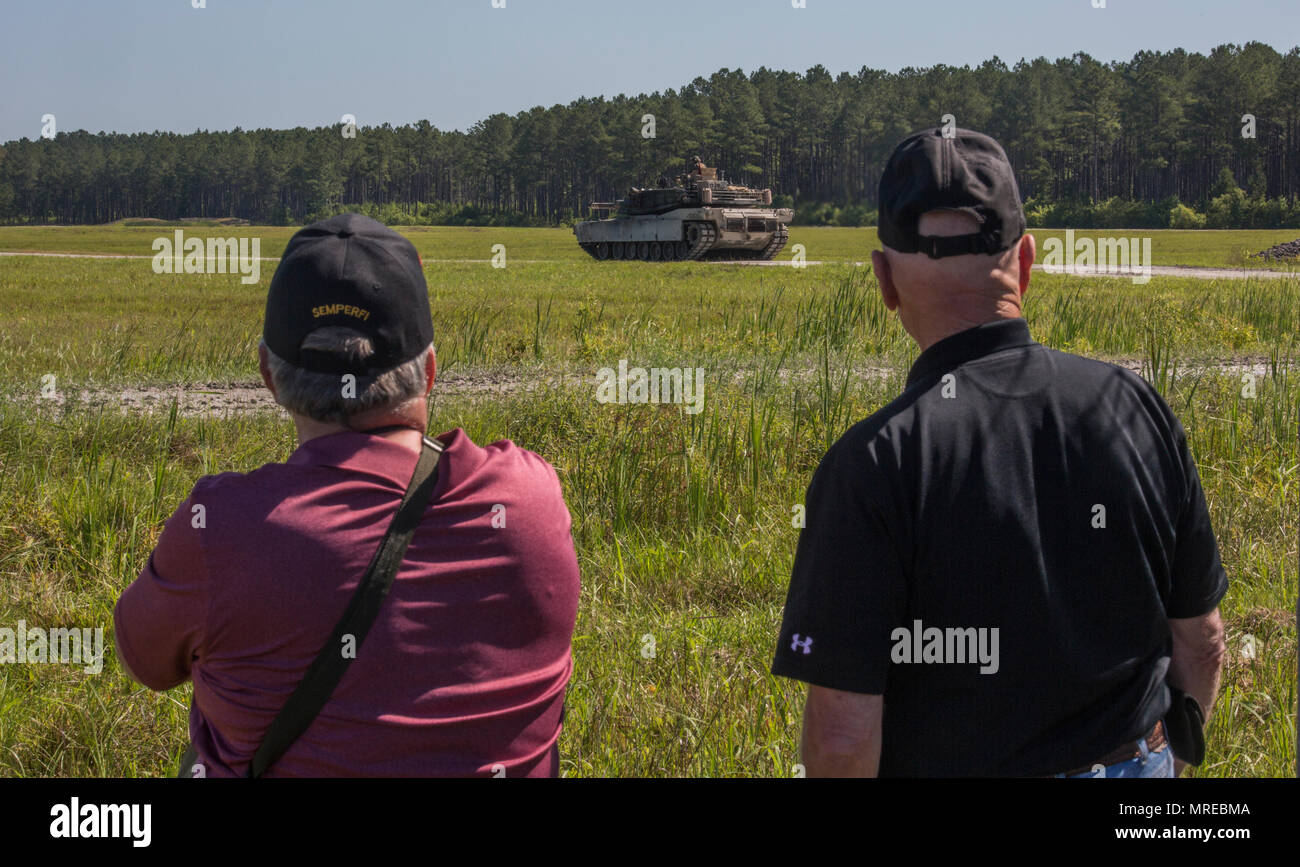 Two Marine tank crew veterans watch as Marines conduct their moving and ...