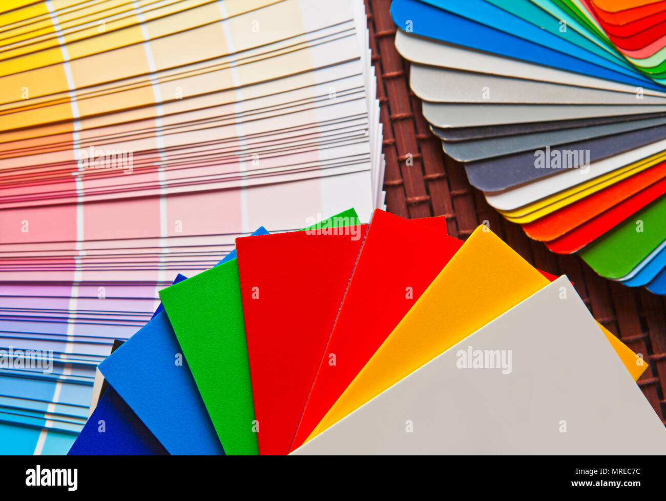 Set of open Pantone/RAL color cards on bamboo mat Stock Photo - Alamy