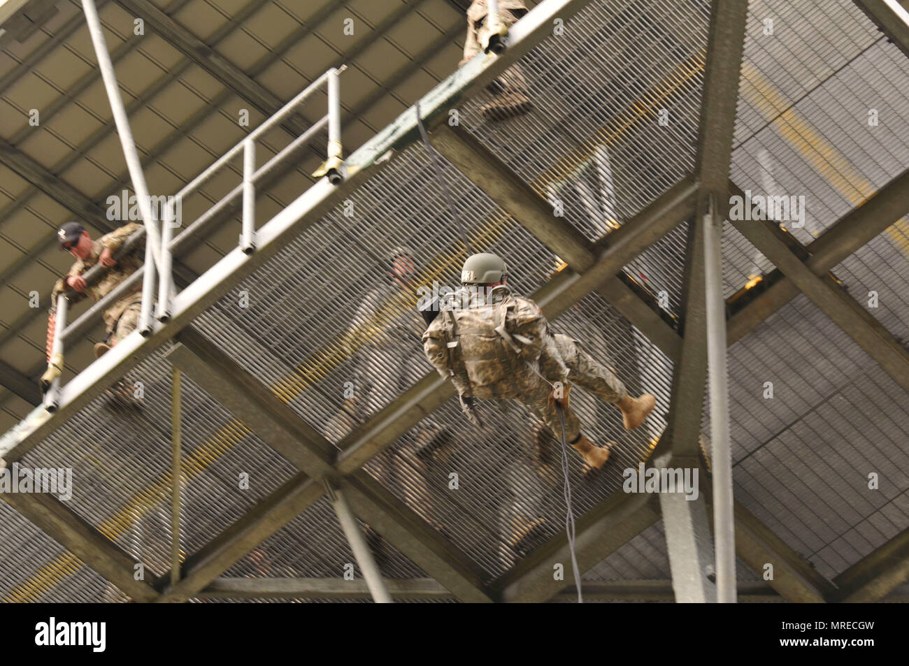 Soldiers and Airmen rappel from a 70-foot tower during the Air Assault ...