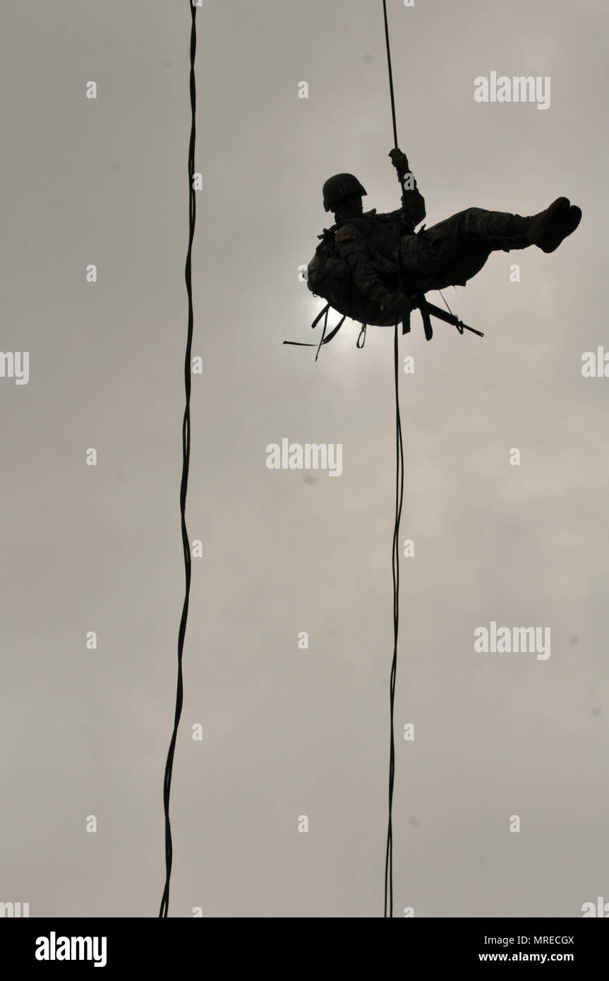 A Soldier rappels from a 70-foot tower during the Air Assault course ...