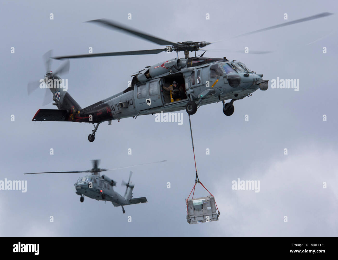 170604-N-GD109-659 PACIFIC OCEAN (June 4, 2017) Two MH-60S Sea Hawk helicopters assigned to the ...