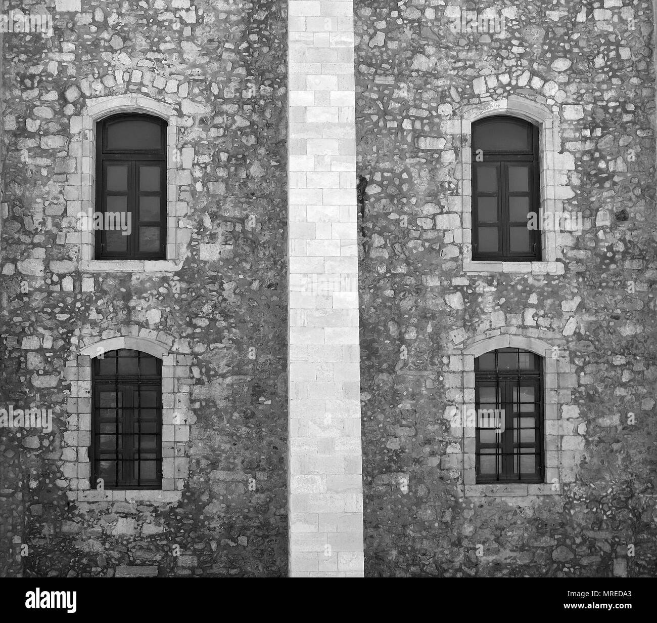 Windows on a stone building Stock Photo - Alamy