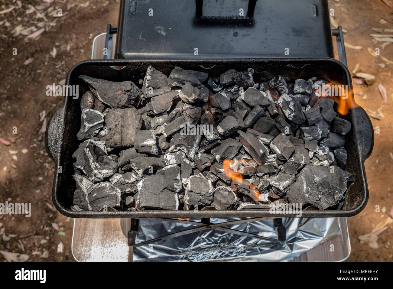 Coals are burned in a BBQ grill. Top view Stock Photo - Alamy