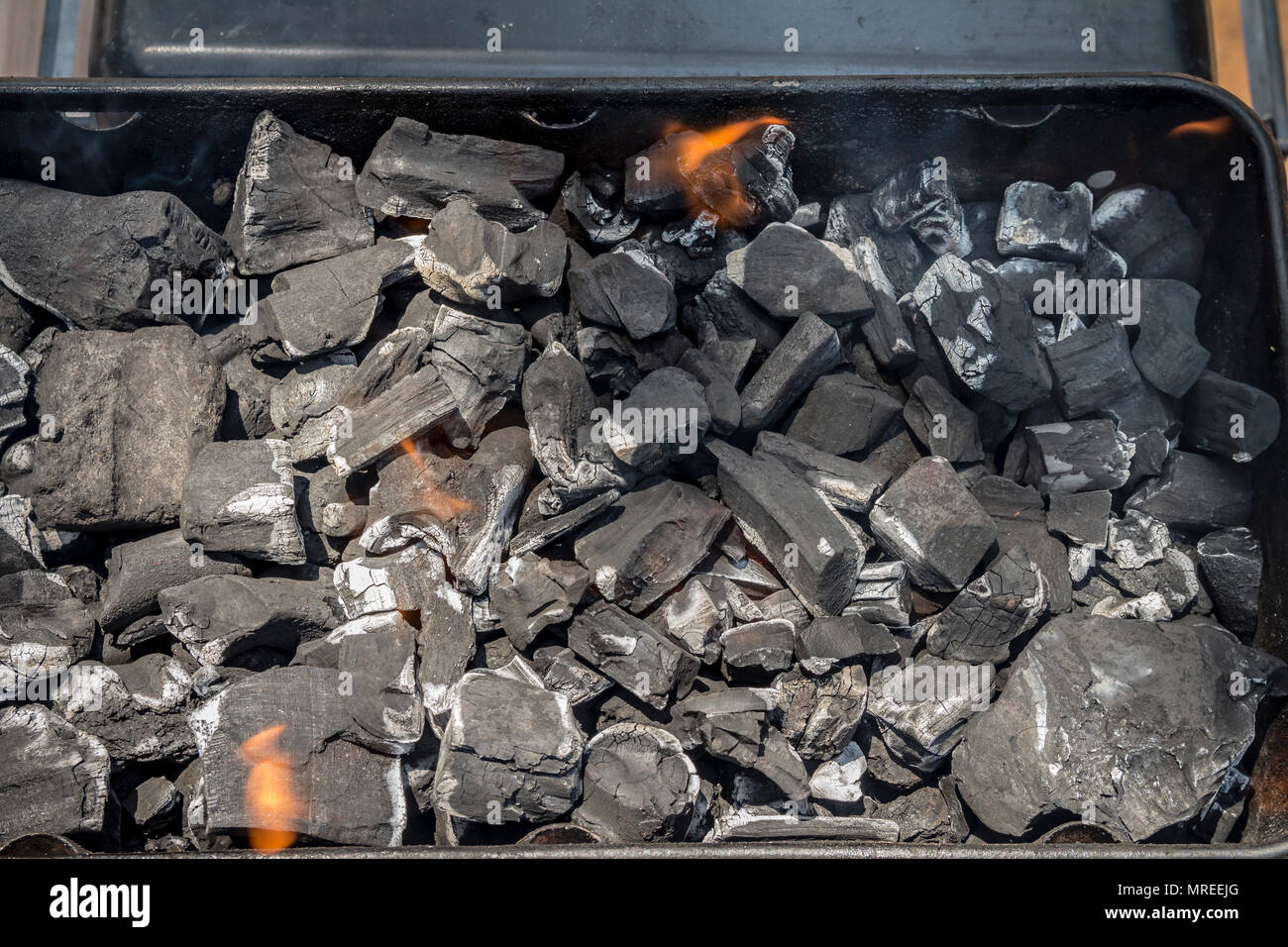 Coals are burned in a BBQ grill. Top view Stock Photo - Alamy