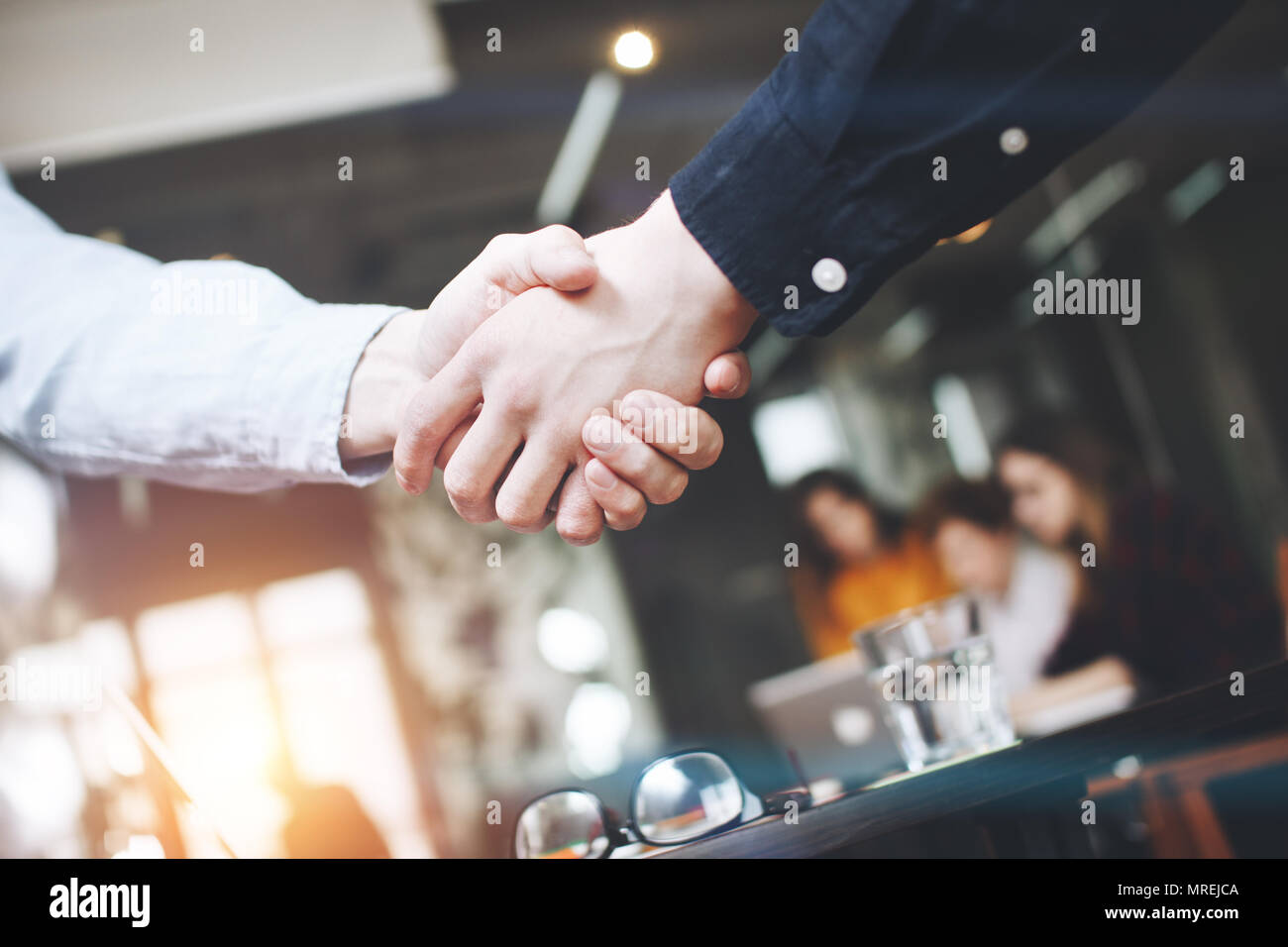Make a deal. Handshake of two businessmen close-up, on a background of ...