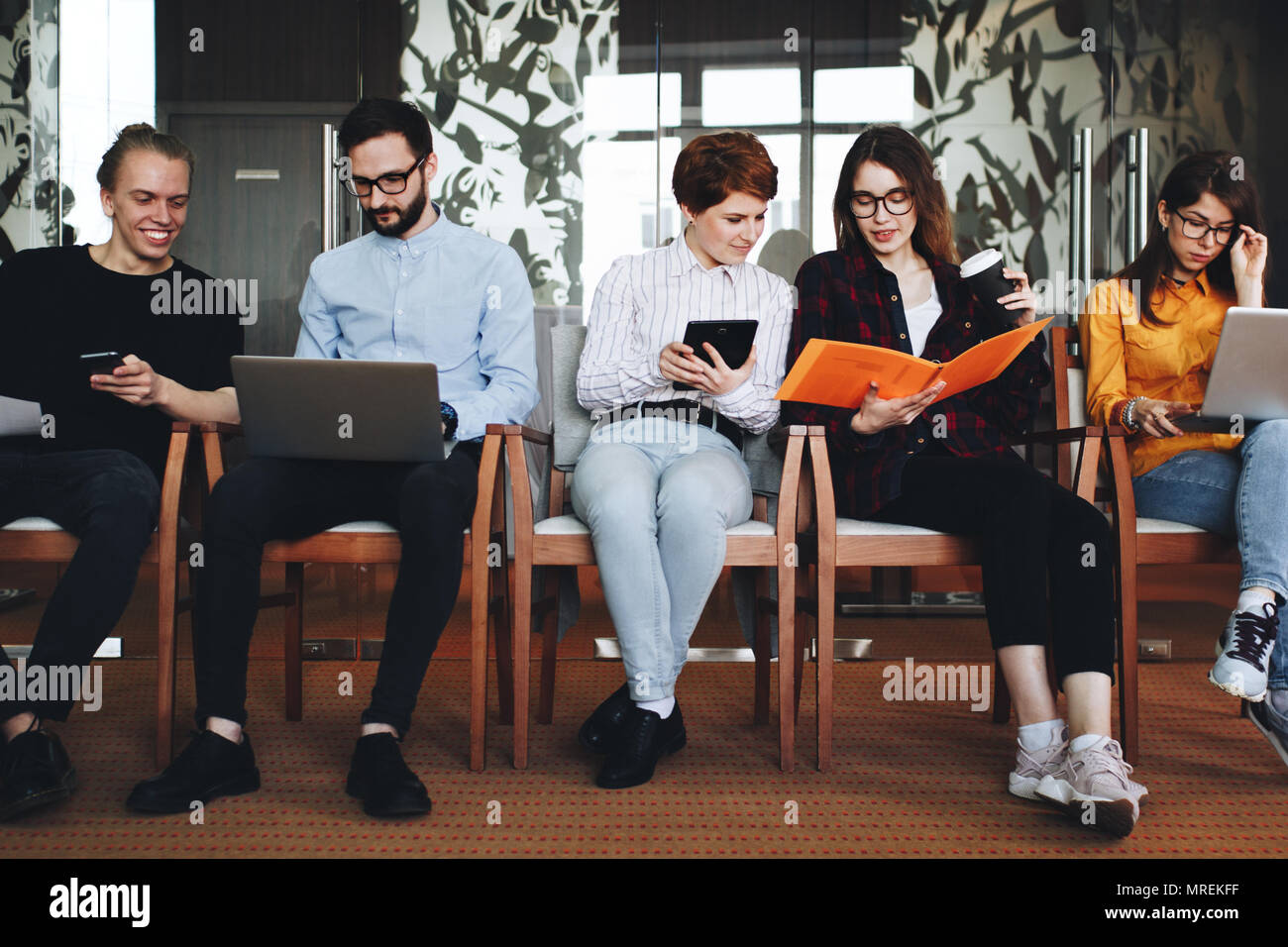 Group of modern hipster friends working together for contemporary ...