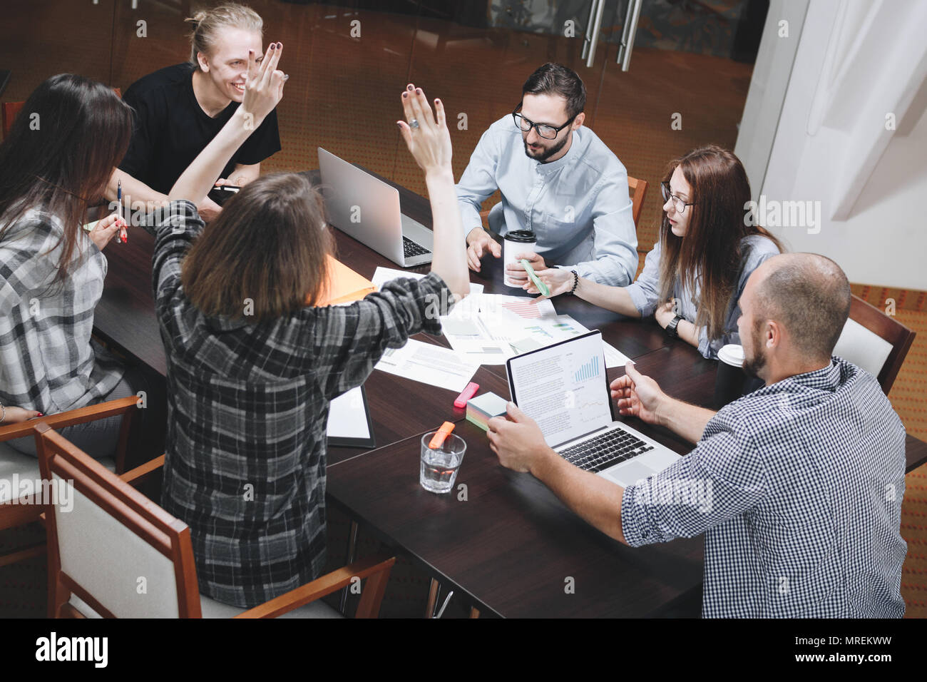 Group of six coworking people meeting in office. Startup team ...