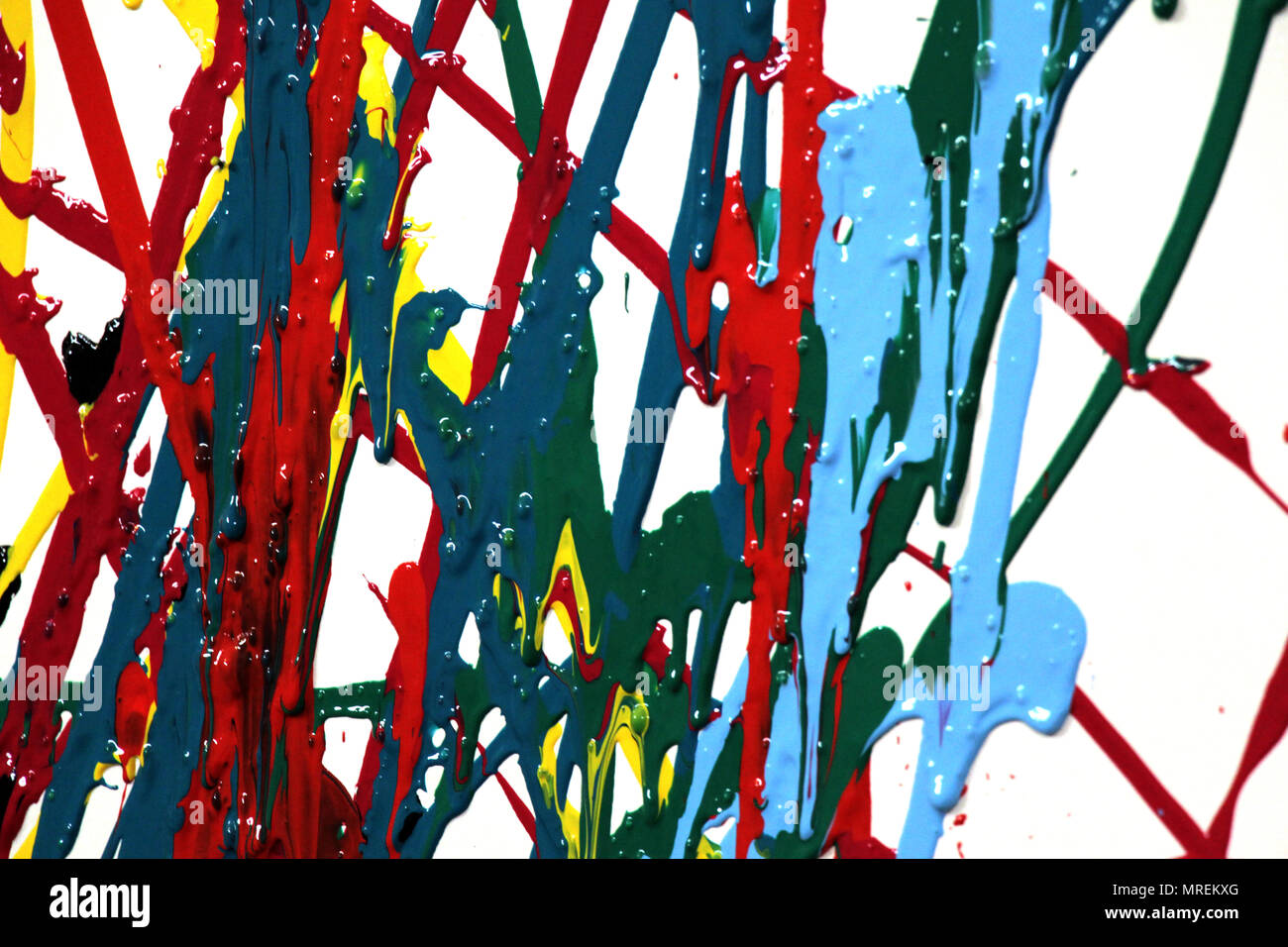 Gouache smeared on a white wall. Various colors and shapes Stock Photo ...