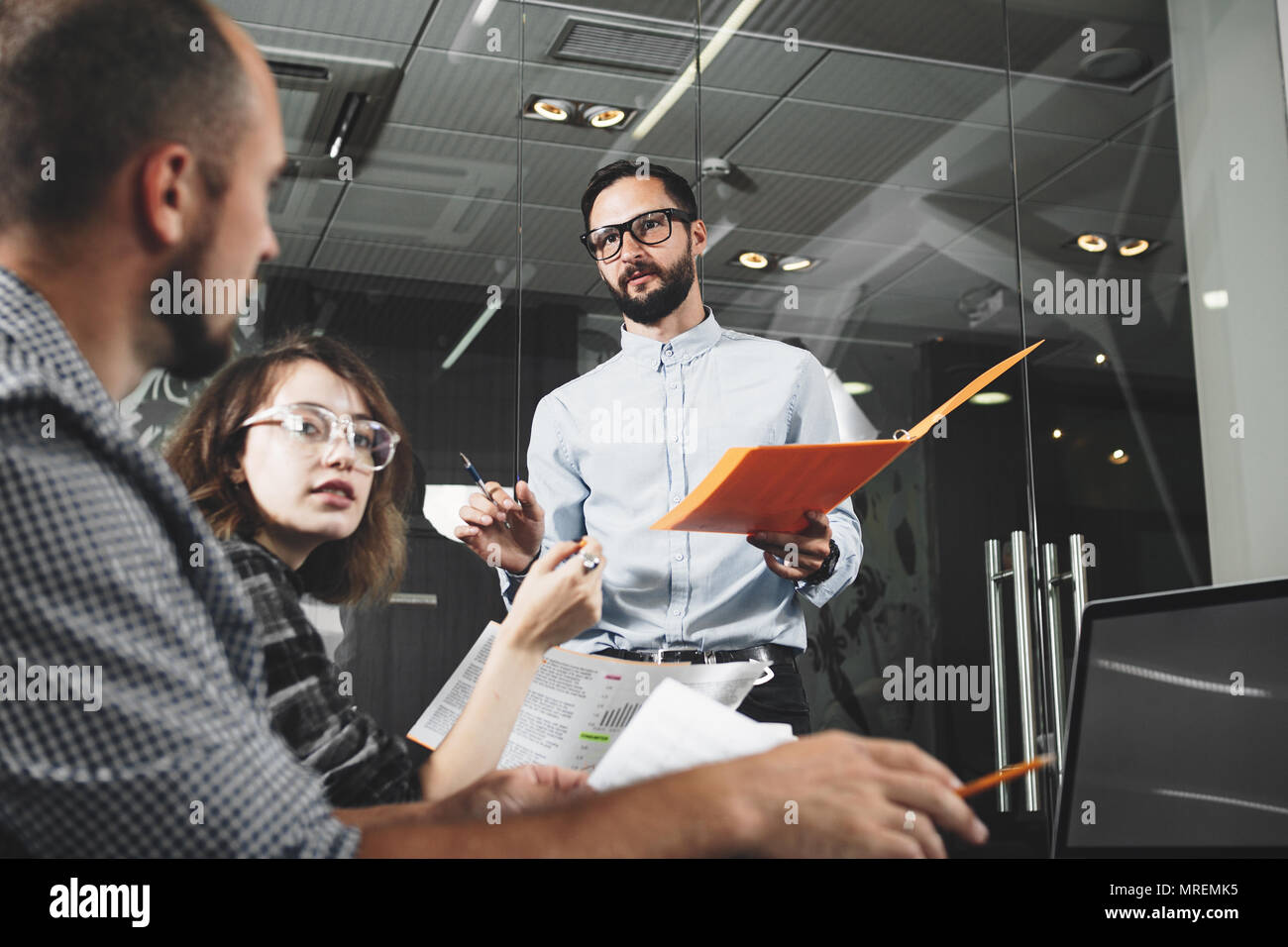 Account manager works with clients in loft office. Training staff ...