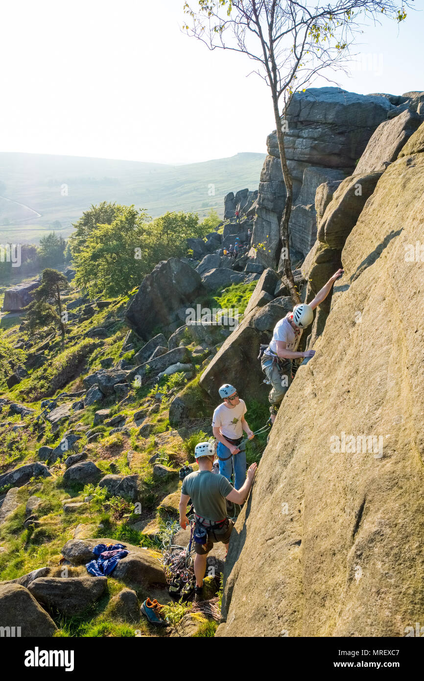 Rock climbing at the Paradise Wall area of Stanage in the Peak District ...