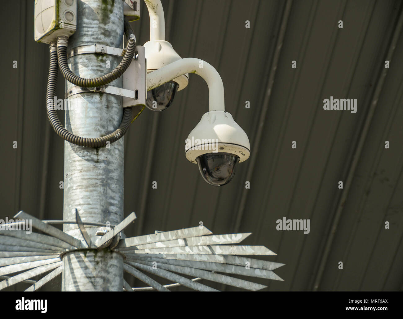 Close up view of a CCTV camera fixed to a metal post Stock Photo - Alamy