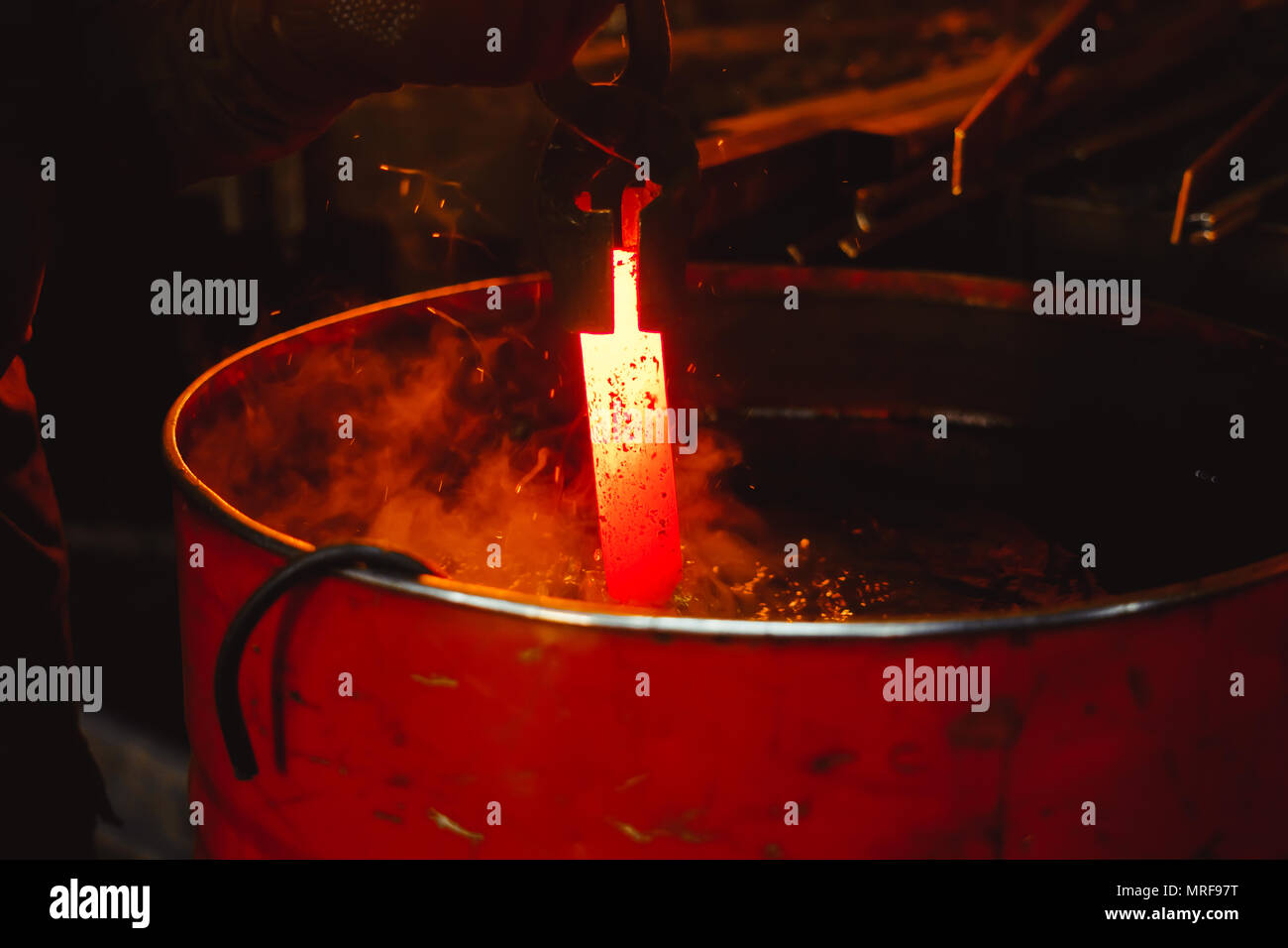 Work carried out in the thermal tempering metal workshops Stock Photo ...