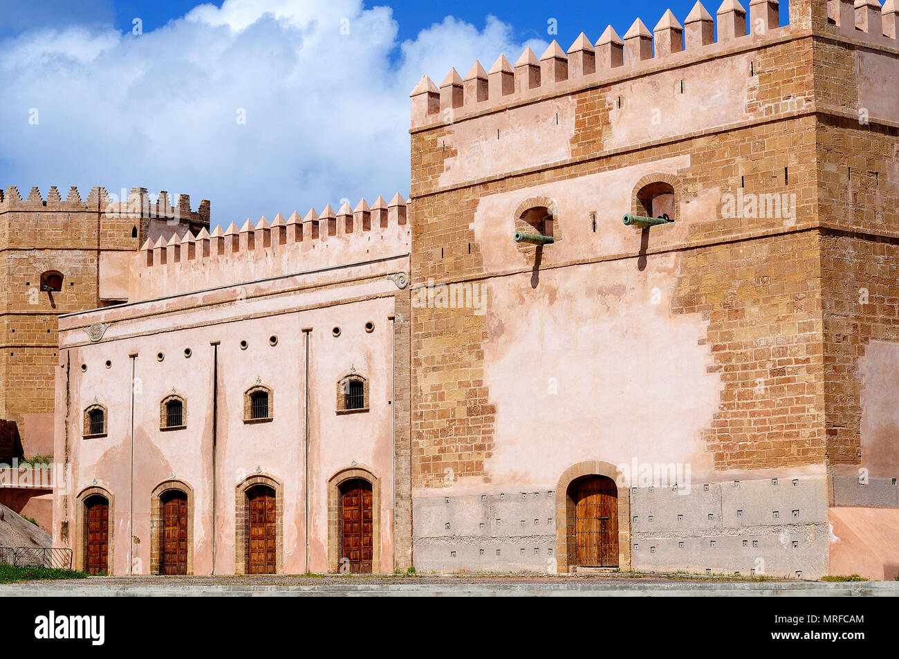 city wall with fortified towers and wooden gates at the kasbah of Rabat ...