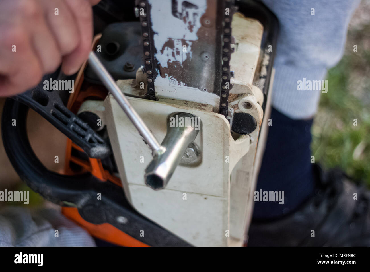 Woodman made a stop in the cutting of trees to sharpen and tighten the ...